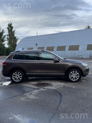 Brown Volkswagen Touareg 2010 in Riga, with an engine capacity of 3.00 L and mileage of 322 thousand km for 7100 €, photo 7 on AUTOMOTO.COM.LV