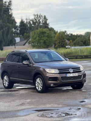Brown Volkswagen Touareg 2010 in Riga, with an engine capacity of 3.00 L and mileage of 322 thousand km for 7100 €, photo 8 on AUTOMOTO.COM.LV