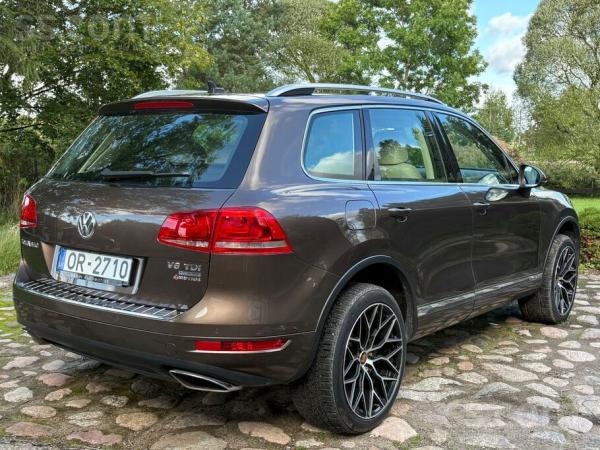 Brown Volkswagen Touareg 2010 in Saldus, with an engine capacity of 3.00 L and mileage of 255 thousand km for 9650 €, photo 4 on AUTOMOTO.COM.LV