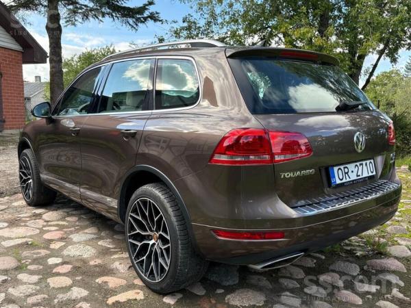 Brown Volkswagen Touareg 2010 in Saldus, with an engine capacity of 3.00 L and mileage of 255 thousand km for 9650 €, photo 6 on AUTOMOTO.COM.LV