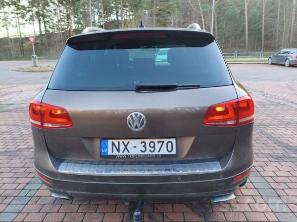 Brown Volkswagen Touareg 2011 in Ventspils, with an engine capacity of 3.00 L and mileage of 281 thousand km for 11500 €, photo 5 on AUTOMOTO.COM.LV