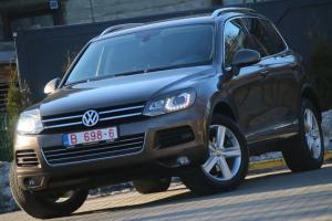 Brown Volkswagen Touareg 2011 in Riga, with an engine capacity of 3.00 L and mileage of 276 thousand km for 10990 €, photo  on AUTOMOTO.COM.LV