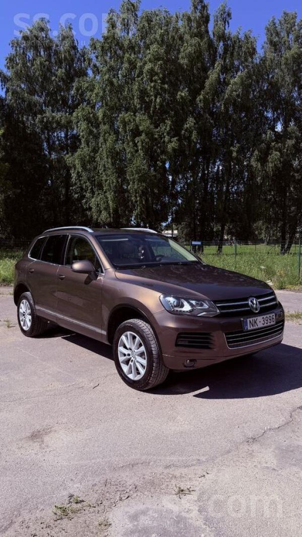 Brown Volkswagen Touareg 2011 in Riga, with an engine capacity of 3.00 L and mileage of 498 thousand km for 8250 €, photo 5 on AUTOMOTO.COM.LV