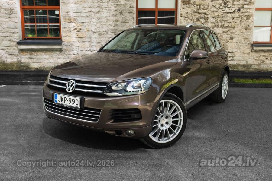 Brown Volkswagen Touareg 2011 in Tallinn, with an engine capacity of 4.20 L and mileage of 242 thousand km for 10999 €, photo 1 on AUTOMOTO.COM.LV