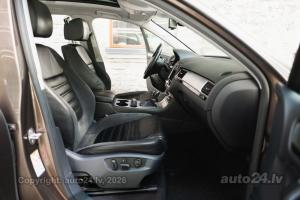 Brown Volkswagen Touareg 2011 in Tallinn, with an engine capacity of 4.20 L and mileage of 242 thousand km for 10999 €, photo 12 on AUTOMOTO.COM.LV