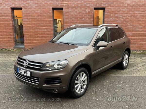 Brown Volkswagen Touareg 2011 in Tallinn, with an engine capacity of 3.00 L and mileage of 243 thousand km for 9800 €, photo 1 on AUTOMOTO.COM.LV