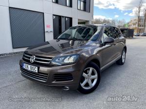 Brown Volkswagen Touareg 2012 in Tartu, with an engine capacity of 3.00 L and mileage of 220 thousand km for 10990 €, photo  on AUTOMOTO.COM.LV