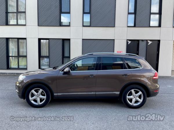 Brūns Volkswagen Touareg 2012 Tartu, ar dzinēja tilpumu 3.00 L un nobraukumu 220 tūkst. km par 10990 €, foto 5 vietnē AUTOMOTO.COM.LV