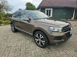 Brown Volkswagen Touareg 2012 in Riga, with an engine capacity of 3.00 L and mileage of 270 thousand km for 11289 €, photo 9 on AUTOMOTO.COM.LV