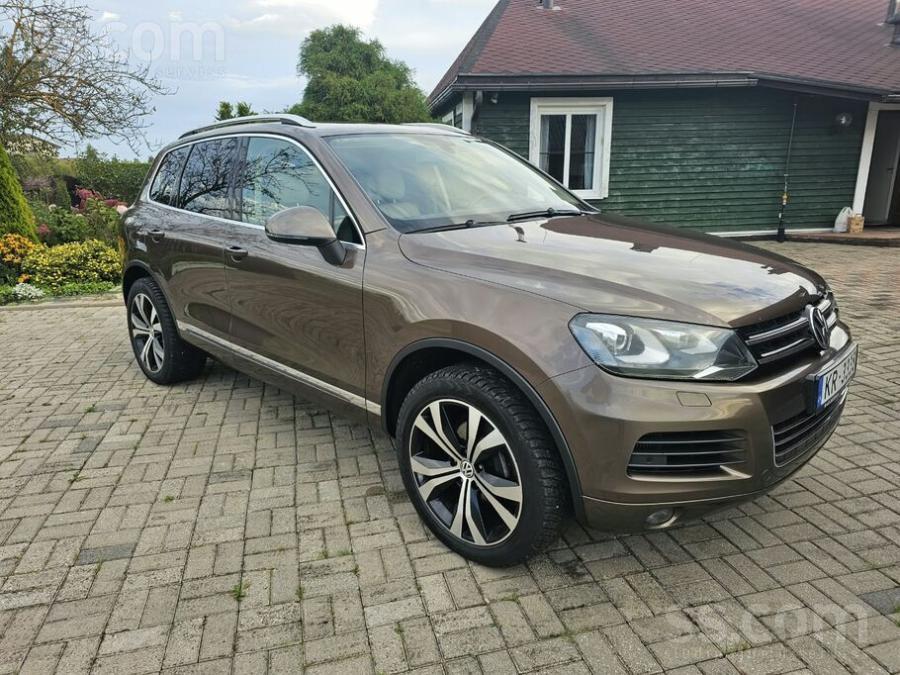 Brown Volkswagen Touareg 2012 in Riga, with an engine capacity of 3.00 L and mileage of 270 thousand km for 11289 €, photo 9 on AUTOMOTO.COM.LV
