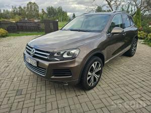 Brown Volkswagen Touareg 2012 in Riga, with an engine capacity of 3.00 L and mileage of 270 thousand km for 11289 €, photo 10 on AUTOMOTO.COM.LV