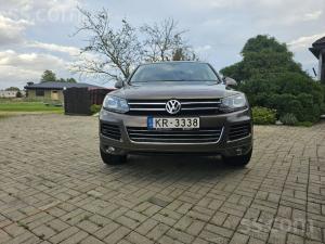 Brown Volkswagen Touareg 2012 in Riga, with an engine capacity of 3.00 L and mileage of 270 thousand km for 11289 €, photo 18 on AUTOMOTO.COM.LV