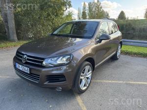 Brown Volkswagen Touareg 2012 in Riga, with an engine capacity of 3.00 L and mileage of 302 thousand km for 10950 €, photo 18 on AUTOMOTO.COM.LV