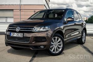 Brown Volkswagen Touareg 2014 in Riga, with an engine capacity of 3.00 L and mileage of 265 thousand km for 13990 €, photo  on AUTOMOTO.COM.LV