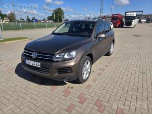 Brown Volkswagen Touareg 2014 in Valmiera, with an engine capacity of 3.00 L and mileage of 398 thousand km for 6750 €, photo  on AUTOMOTO.COM.LV
