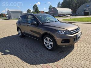 Brown Volkswagen Touareg 2014 in Valmiera, with an engine capacity of 3.00 L and mileage of 398 thousand km for 6750 €, photo 4 on AUTOMOTO.COM.LV