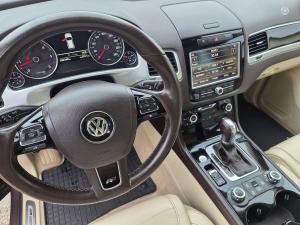 Brown Volkswagen Touareg 2014 in Vilnius, with an engine capacity of 2.97 L and mileage of 290 thousand km for 12900 €, photo 12 on AUTOMOTO.COM.LV