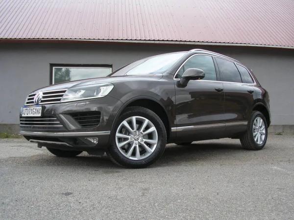 Brown Volkswagen Touareg 2015 in Sigulda, with an engine capacity of 3.00 L and mileage of 260 thousand km for 17350 €, photo 1 on AUTOMOTO.COM.LV