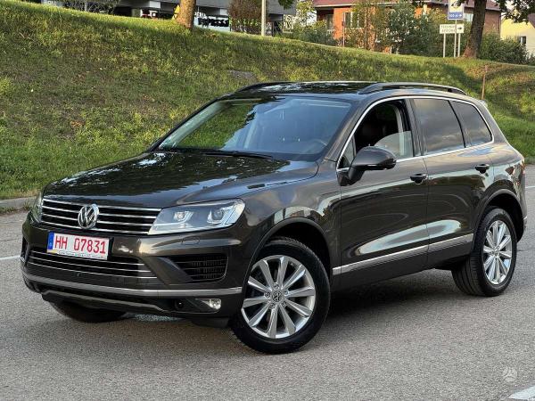 Brown Volkswagen Touareg 2015 in Jonava, with an engine capacity of 3.00 L and mileage of 275 thousand km for 15999 €, photo 4 on AUTOMOTO.COM.LV