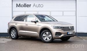 Brown Volkswagen Touareg 2018 in Riga, with an engine capacity of 3.00 L and mileage of 194 thousand km for 33950 €, photo 2 on AUTOMOTO.COM.LV
