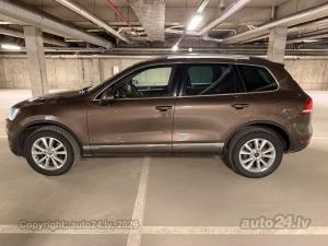 Brown Volkswagen Touareg 2012 in Valmiera, with an engine capacity of 3.00 L and mileage of 368 thousand km for 8990 €, photo 3 on AUTOMOTO.COM.LV