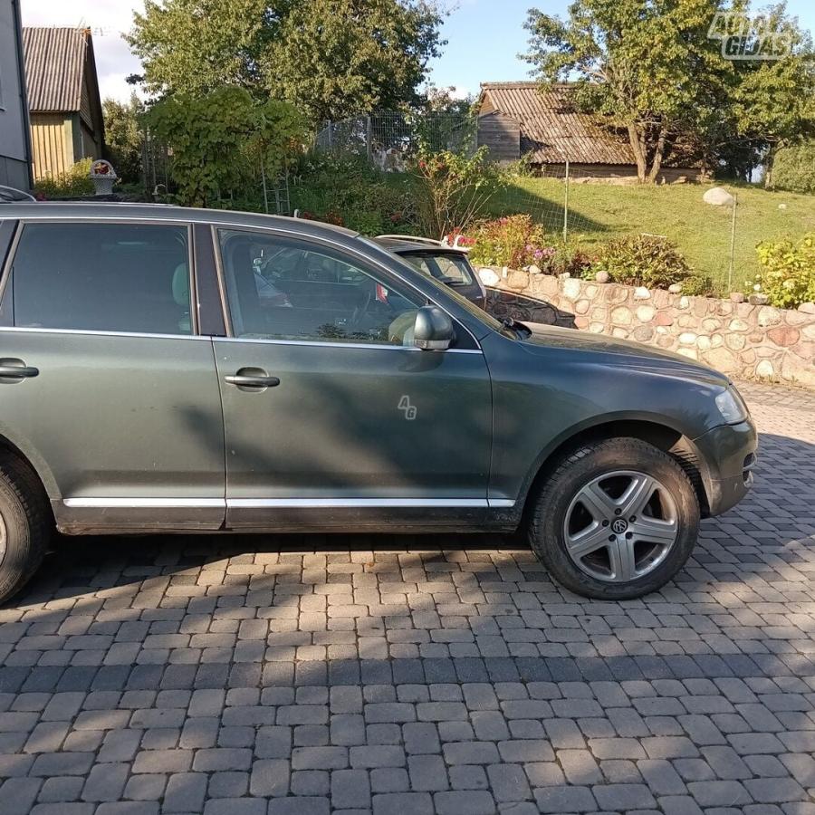 Green Volkswagen Touareg 2006 in Vilnius, with an engine capacity of 3.00 L and mileage of 322 thousand km for 3600 €, photo 8 on AUTOMOTO.COM.LV