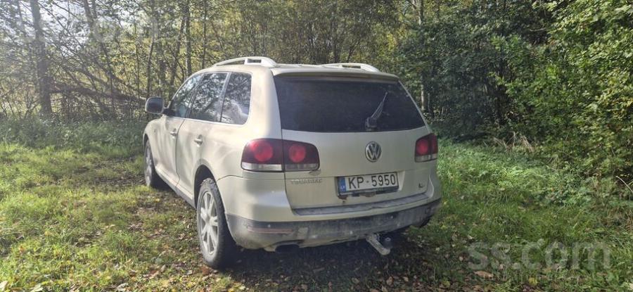 Grey Volkswagen Touareg 2007 in Liepaja, with an engine capacity of 3.00 L and mileage of 410 thousand km for 1950 €, photo 12 on AUTOMOTO.COM.LV