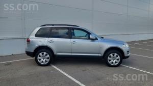 Grey Volkswagen Touareg 2009 in Riga, with an engine capacity of 3.00 L and mileage of 343 thousand km for 4990 €, photo 26 on AUTOMOTO.COM.LV