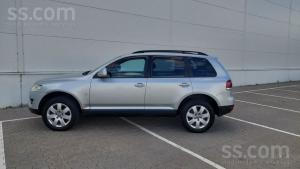 Grey Volkswagen Touareg 2009 in Riga, with an engine capacity of 3.00 L and mileage of 343 thousand km for 4990 €, photo 27 on AUTOMOTO.COM.LV