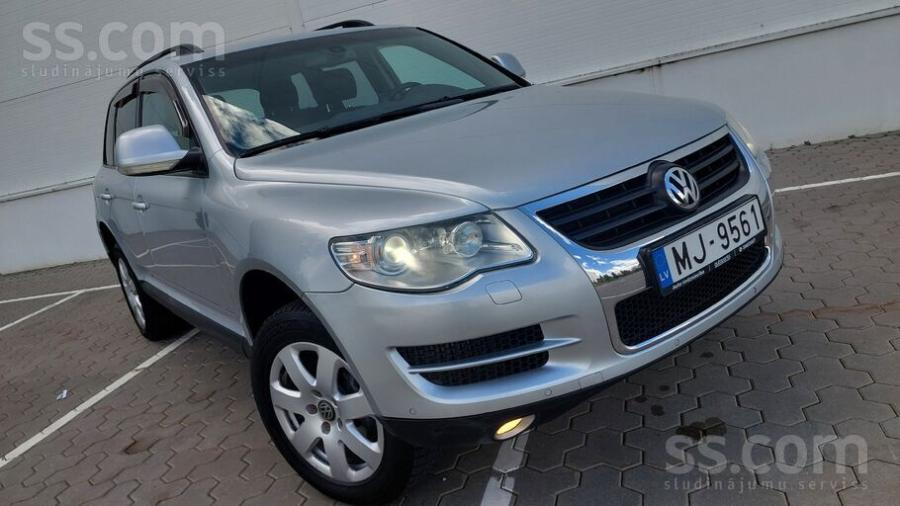 Grey Volkswagen Touareg 2009 in Riga, with an engine capacity of 3.00 L and mileage of 343 thousand km for 4990 €, photo 30 on AUTOMOTO.COM.LV