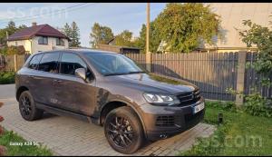 Grey Volkswagen Touareg 2011 in Riga, with an engine capacity of 3.00 L and mileage of 295 thousand km for 10700 €, photo  on AUTOMOTO.COM.LV