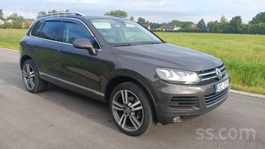 Grey Volkswagen Touareg 2011 in Jelgava, with an engine capacity of 3.00 L and mileage of 206 thousand km for 12100 €, photo 11 on AUTOMOTO.COM.LV