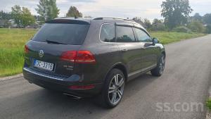 Grey Volkswagen Touareg 2011 in Jelgava, with an engine capacity of 3.00 L and mileage of 206 thousand km for 12100 €, photo 12 on AUTOMOTO.COM.LV