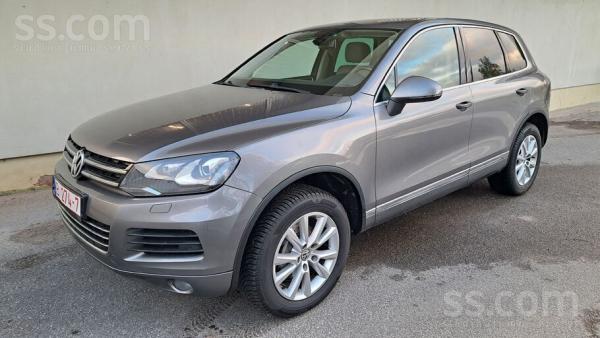 Grey Volkswagen Touareg 2011 in Ogre, with an engine capacity of 3.00 L and mileage of 278 thousand km for 11250 €, photo 6 on AUTOMOTO.COM.LV