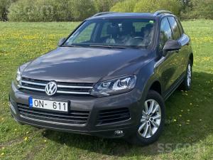 Grey Volkswagen Touareg 2012 in Riga, with an engine capacity of 3.00 L and mileage of 237 thousand km for 11899 €, photo  on AUTOMOTO.COM.LV