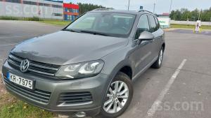 Grey Volkswagen Touareg 2013 in Riga, with an engine capacity of 3.00 L and mileage of 300 thousand km for 7700 €, photo 3 on AUTOMOTO.COM.LV
