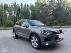 Grey Volkswagen Touareg 2014 in Plunge, with an engine capacity of 3.60 L and mileage of 310 thousand km for 6800 €, photo  on AUTOMOTO.COM.LV