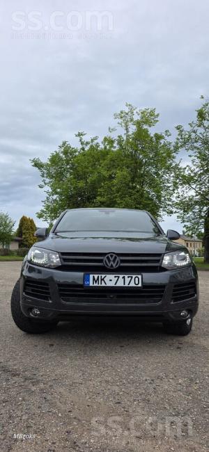 Grey Volkswagen Touareg 2014 in Valmiera, with an engine capacity of 3.00 L and mileage of 246 thousand km for 16700 €, photo  on AUTOMOTO.COM.LV