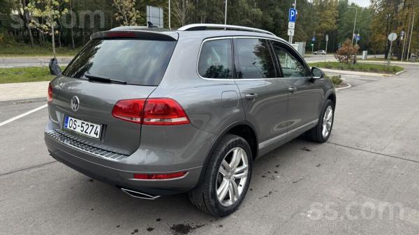 Volkswagen Touareg 2014 in Riga on AUTOMOTO.COM.LV Grey Volkswagen Touareg 2014 in Riga, with an engine capacity of 3.00 L and mileage of 236 thousand km for 13000 €, photo 6 on AUTOMOTO.COM.LV