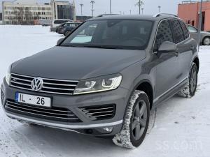 Grey Volkswagen Touareg 2015 in Riga, with an engine capacity of 3.00 L and mileage of 127 thousand km for 21500 €, photo  on AUTOMOTO.COM.LV