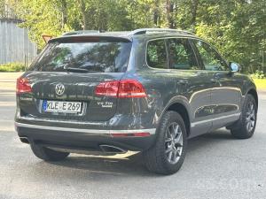 Grey Volkswagen Touareg 2015 in Riga, with an engine capacity of 3.00 L and mileage of 249 thousand km for 14390 €, photo 11 on AUTOMOTO.COM.LV