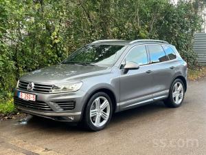 Pelēks Volkswagen Touareg 2015 Rīga, ar dzinēja tilpumu 4.20 L un nobraukumu 0 tūkst. km par 9899 €, foto  vietnē AUTOMOTO.COM.LV