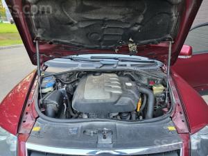 Red Volkswagen Touareg 2005 in Riga, with an engine capacity of 2.50 L and mileage of 270 thousand km for 2200 €, photo 16 on AUTOMOTO.COM.LV