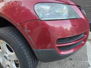 Red Volkswagen Touareg 2005 in Riga, with an engine capacity of 2.50 L and mileage of 270 thousand km for 2200 €, photo 24 on AUTOMOTO.COM.LV
