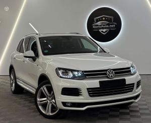 White Volkswagen Touareg 2013 in Marijampole, with an engine capacity of 2.97 L and mileage of 317 thousand km for 13450 €, photo 1 on AUTOMOTO.COM.LV