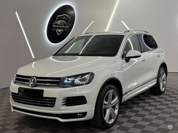 White Volkswagen Touareg 2013 in Marijampole, with an engine capacity of 2.97 L and mileage of 317 thousand km for 12999 €, photo 6 on AUTOMOTO.COM.LV