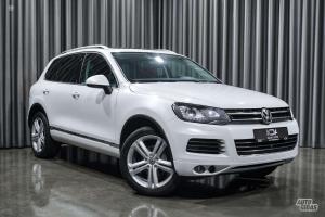 White Volkswagen Touareg 2014 in Marijampole, with an engine capacity of 3.00 L and mileage of 237 thousand km for 14450 €, photo  on AUTOMOTO.COM.LV