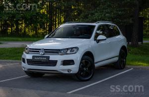 White Volkswagen Touareg 2014 in Riga, with an engine capacity of 3.00 L and mileage of 194 thousand km for 13350 €, photo  on AUTOMOTO.COM.LV