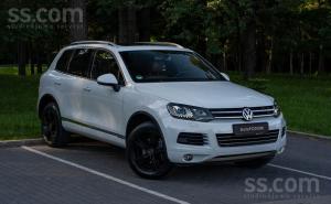 White Volkswagen Touareg 2014 in Riga, with an engine capacity of 3.00 L and mileage of 194 thousand km for 13350 €, photo 7 on AUTOMOTO.COM.LV