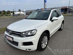 White Volkswagen Touareg 2014 in Riga, with an engine capacity of 3.00 L and mileage of 277 thousand km for 10800 €, photo 1 on AUTOMOTO.COM.LV